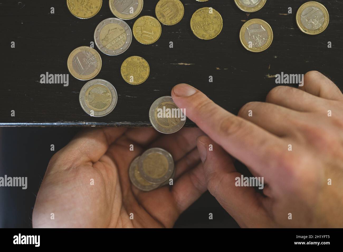 business man counting money. rich male hands holds and count coins of ...