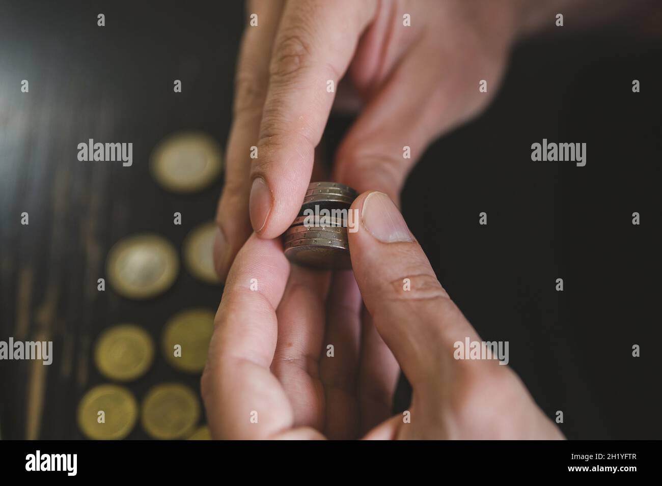 business man counting money. rich male hands holds and count coins of ...