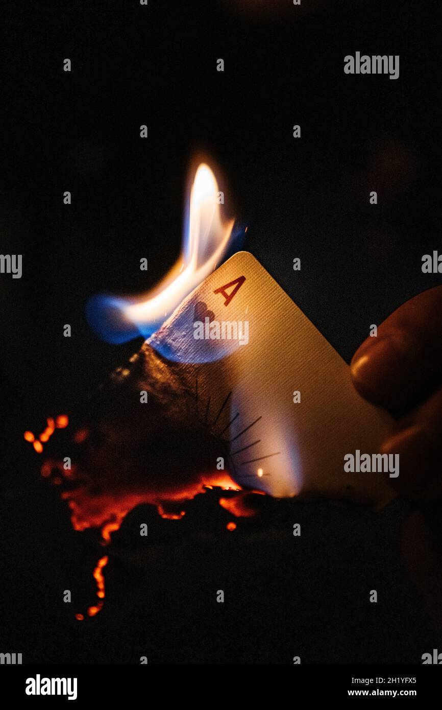 Black ace card on fire Stock Photo - Alamy