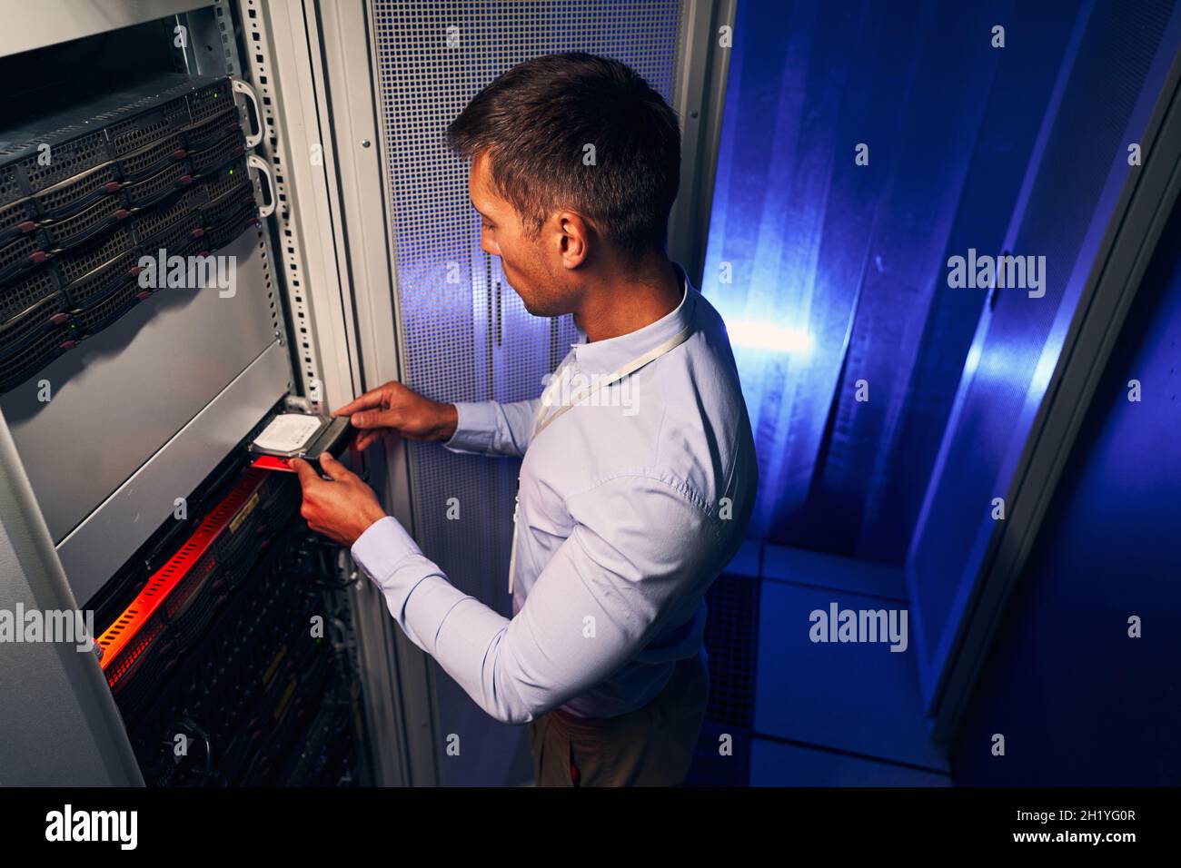 Skilled system administrator replacing old hardware component Stock ...