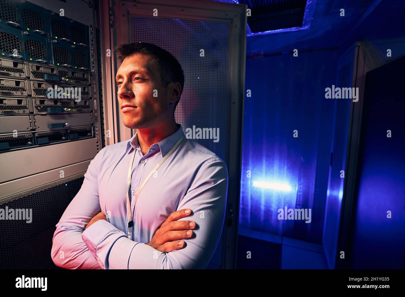 Data center system administrator pondering over something Stock Photo ... Data center system administrator pondering over something Stock Photo ...