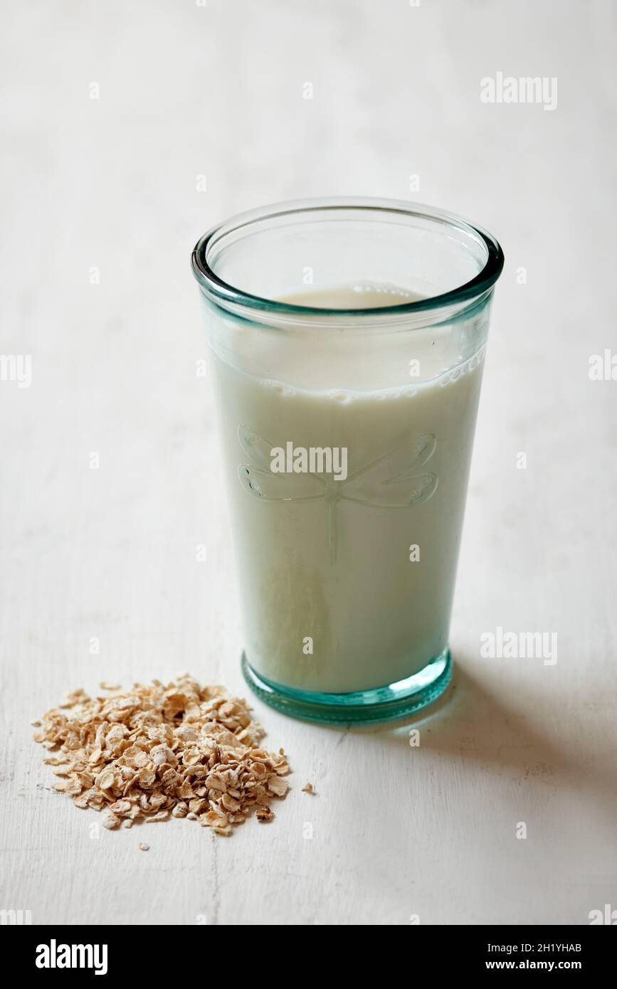 Oats and a glass of oat milk Stock Photo - Alamy