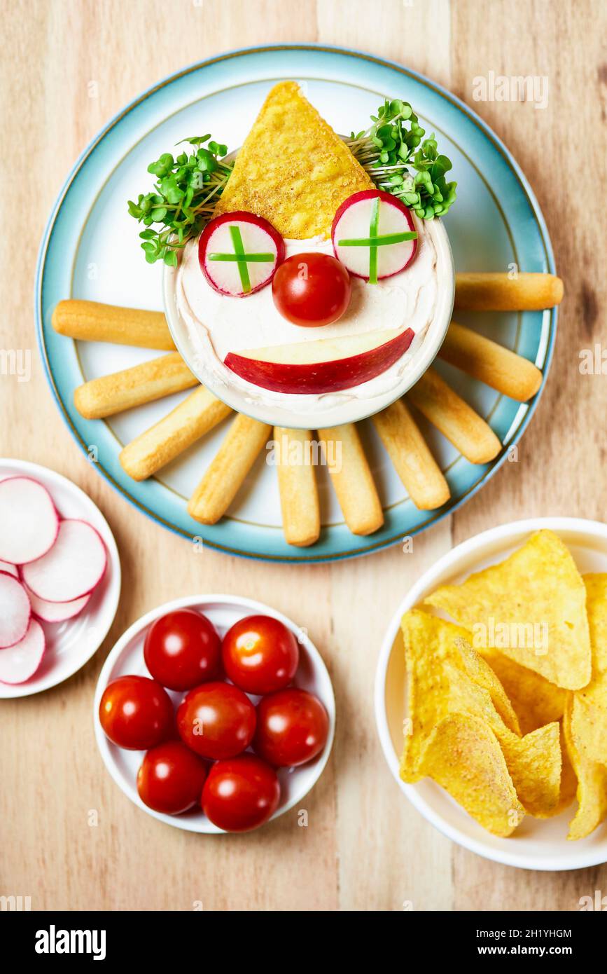A clown face dip for a kids party Stock Photo - Alamy