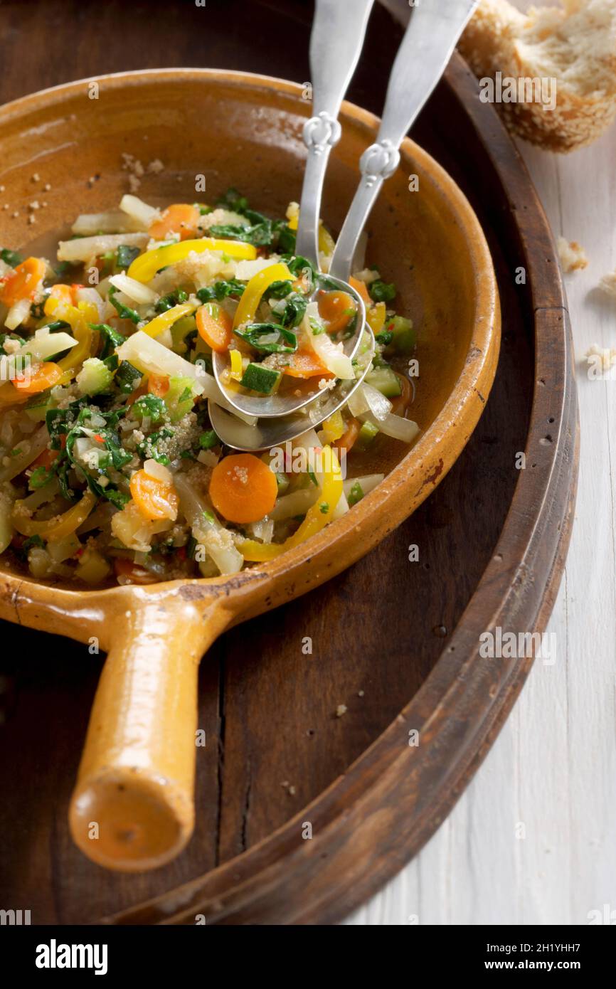 Colourful amaranth vegetable stew in a clay bowl Stock Photo - Alamy