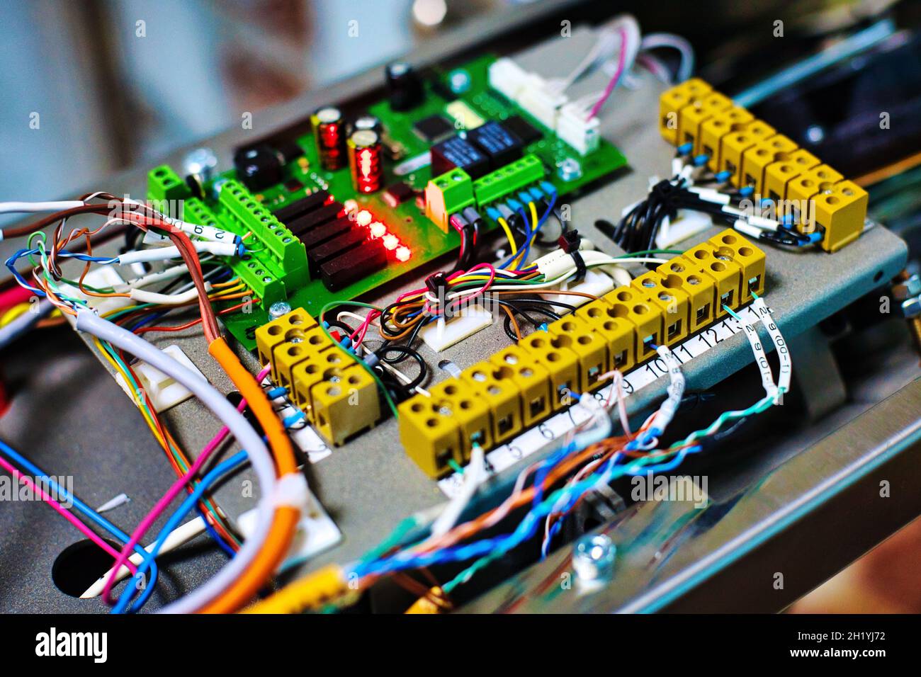 Electronic device with wires and chips close-up. Background Stock Photo ...