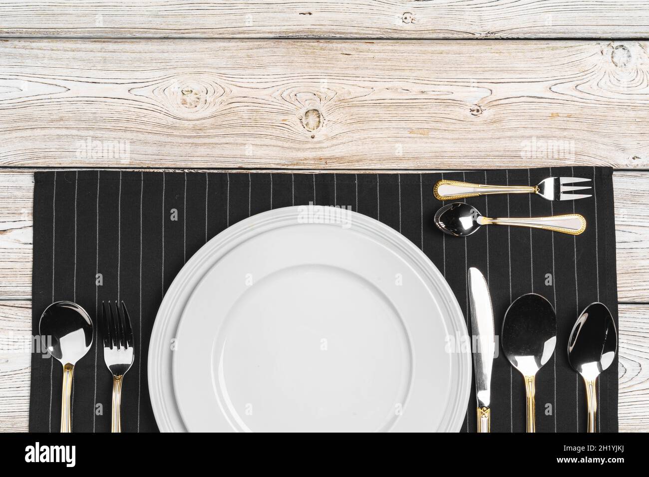 Top view of table setup on dark wooden background Stock Photo - Alamy