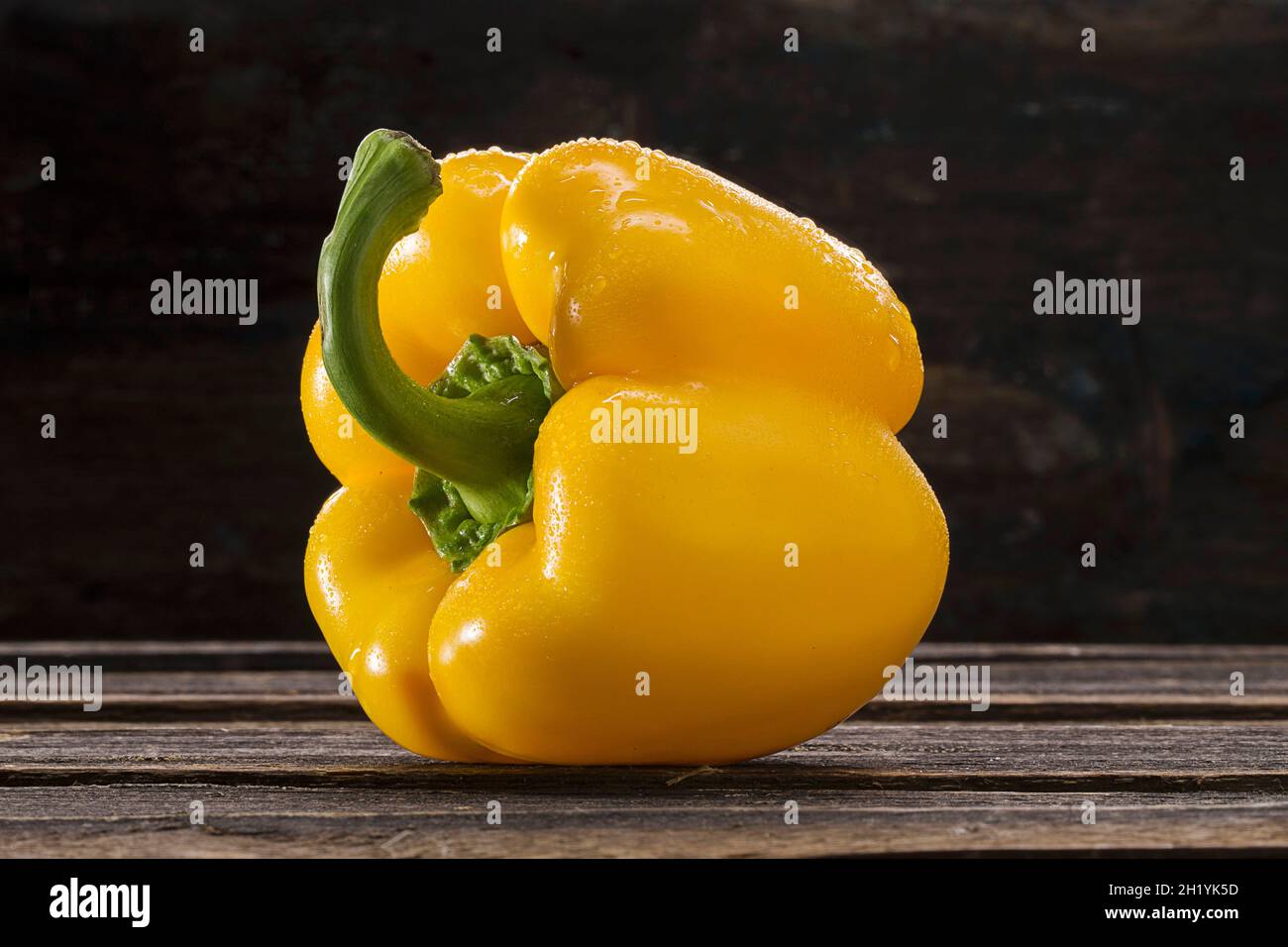 Yellow pepper with drops of water Stock Photo - Alamy