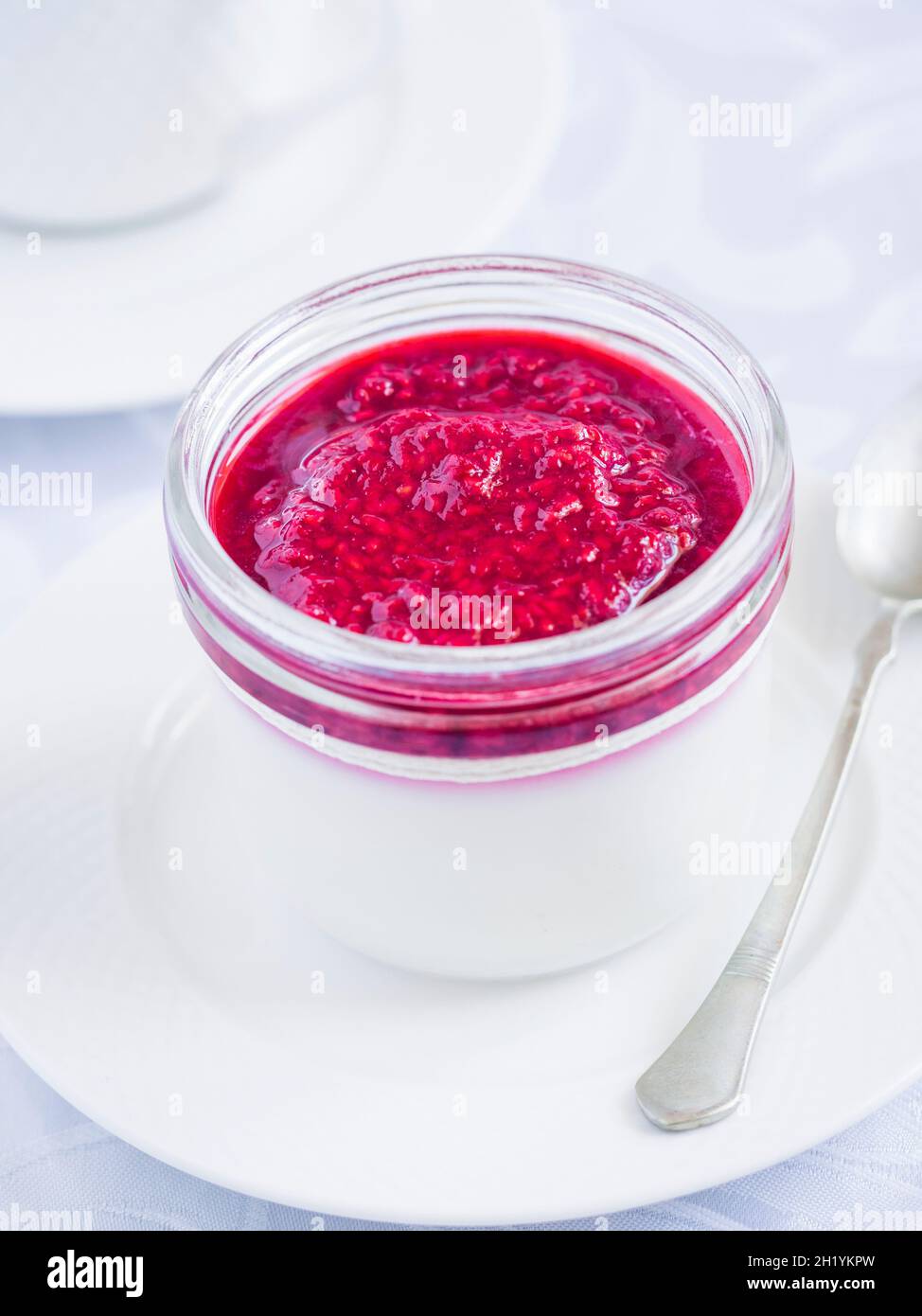 A glass of yoghurt with fruit pureé Stock Photo - Alamy