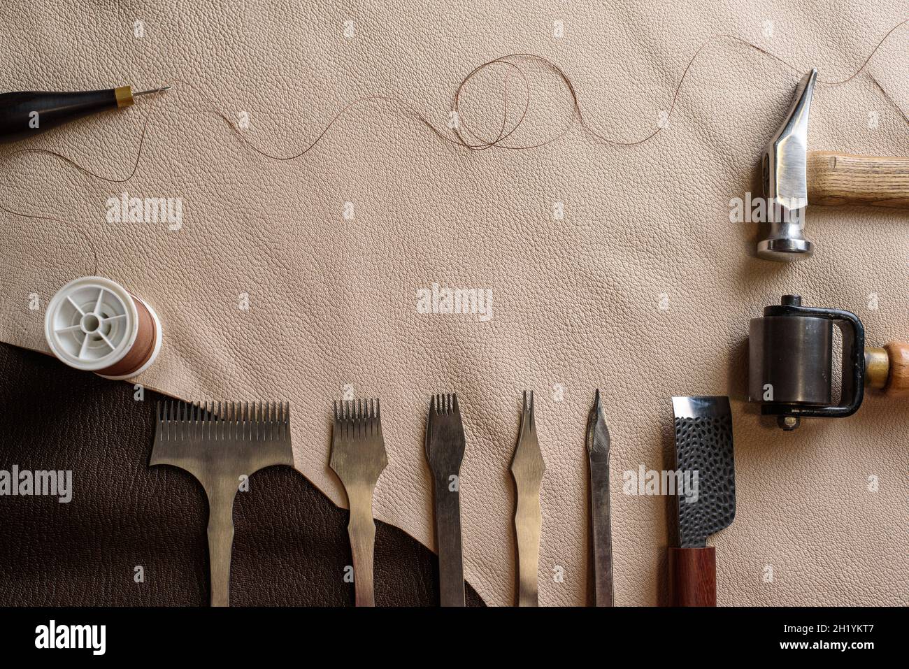 Shoemaking tools for sewing handmade shoes in workshop. Punches, awl ...