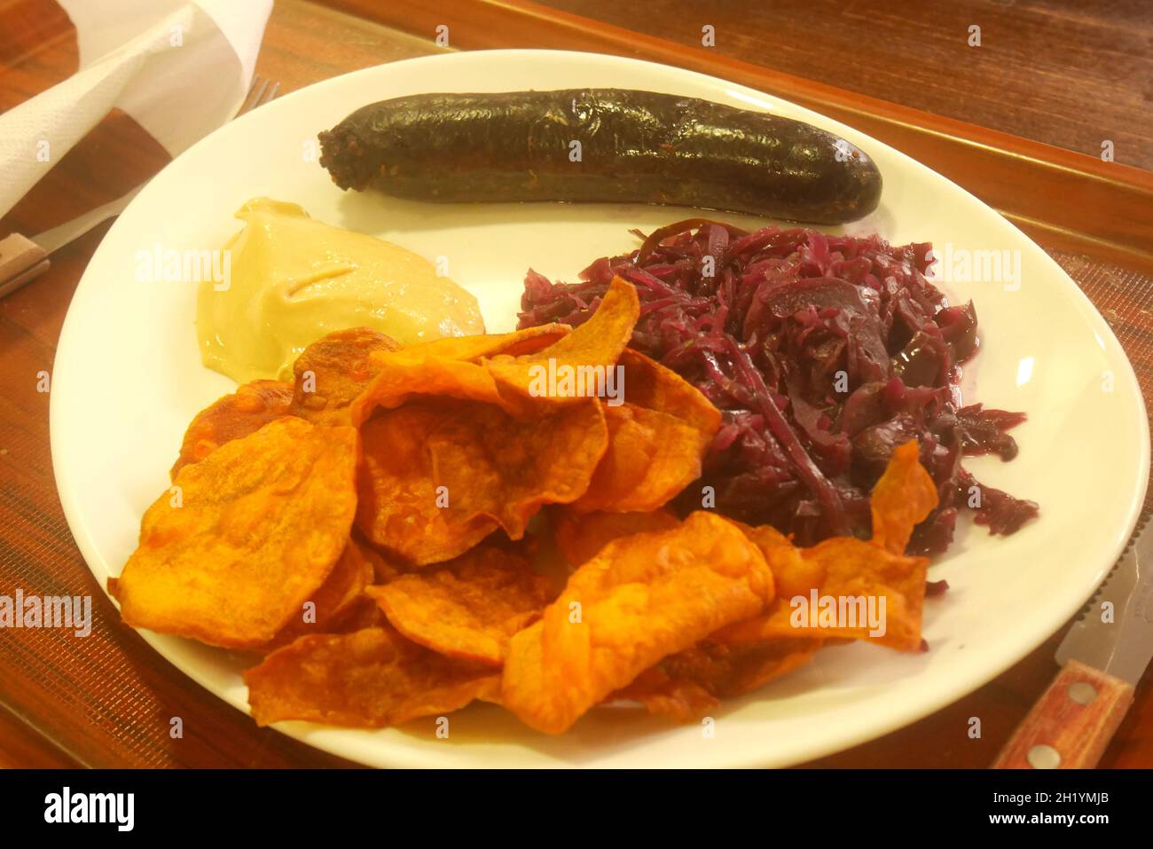Traditional Hungarian food: sausage, fried potato, braised red cabbage ...