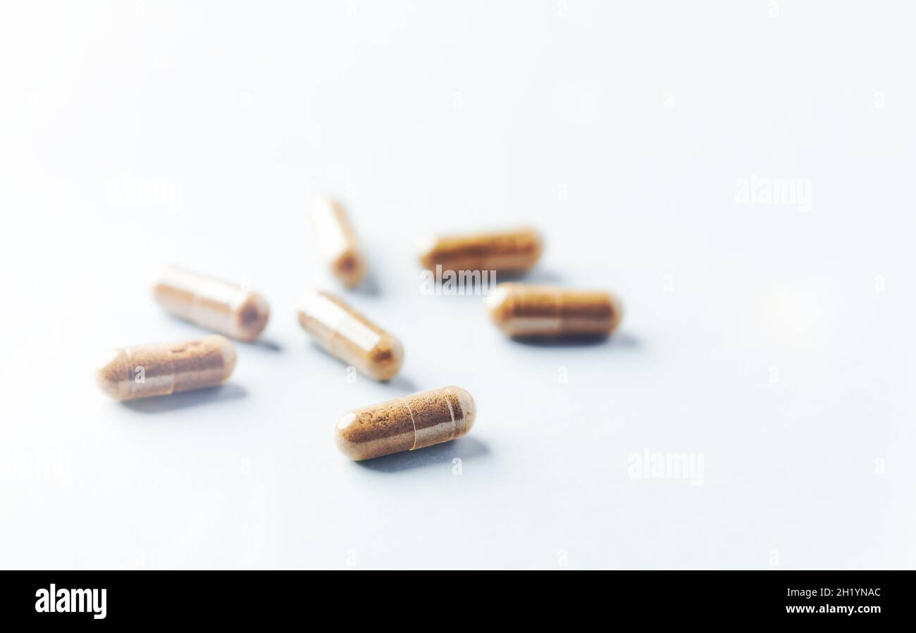 Ashwagandha (Withania somnifera) capsules. Bright paper background ...