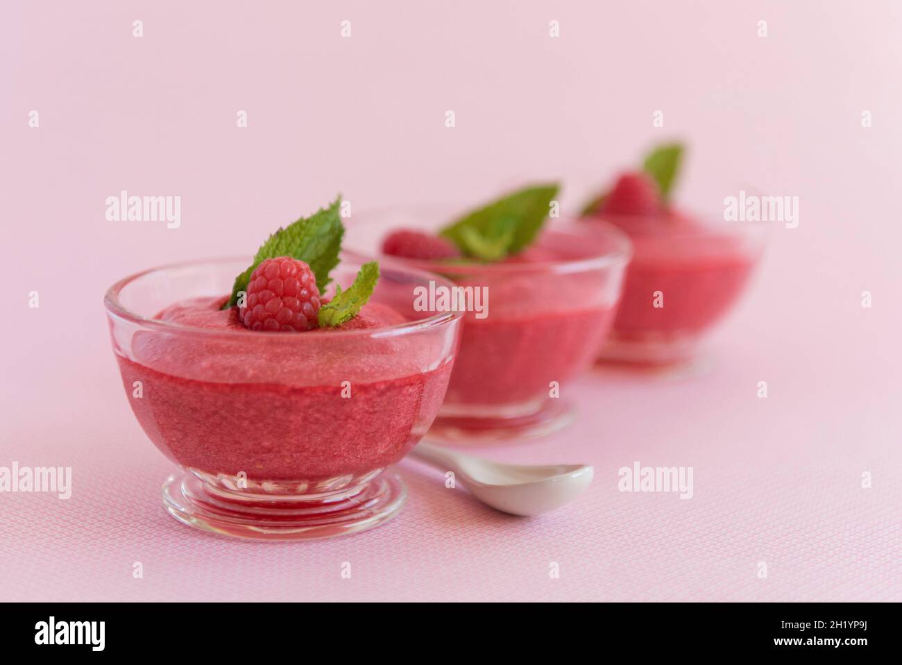Raspberry mousse in glass bowls Stock Photo - Alamy