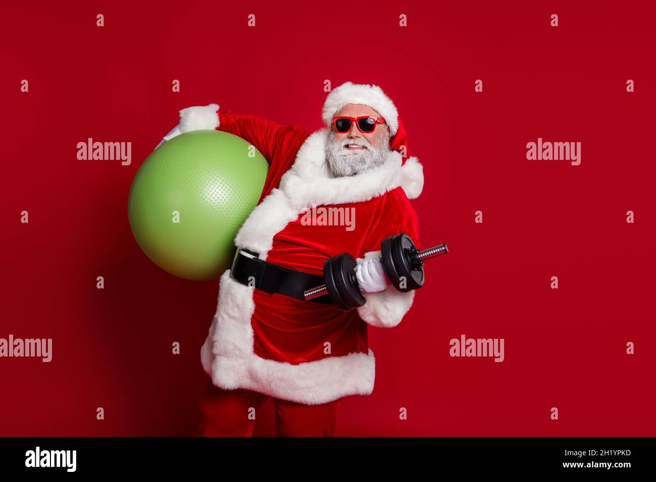 Photo of handsome strong santa claus wear red costume hat dark holding ...