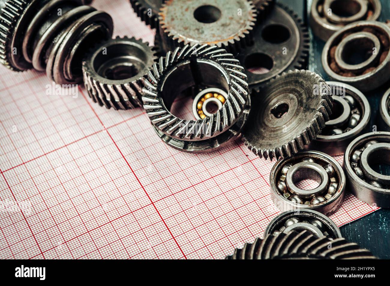 Car parts on graph paper close up. Engineering concept Stock Photo - Alamy