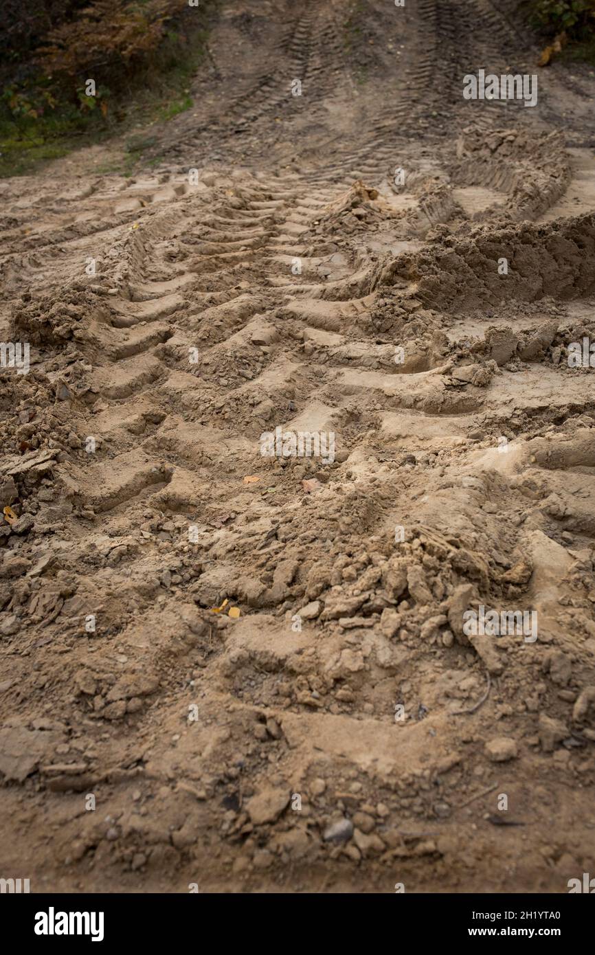 Wheel trail on sandy ground from large transport, tractor on ...