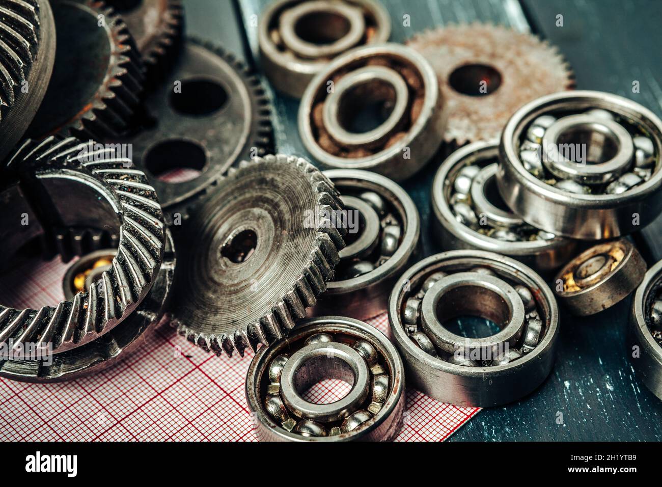 Car parts on graph paper close up. Engineering concept Stock Photo - Alamy