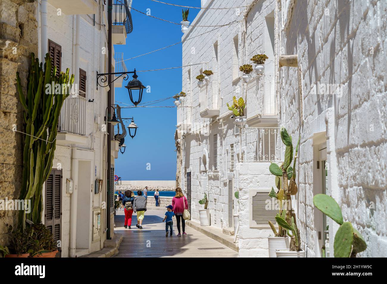 Monopoli, Puglia, Italy June 2021: Narrow walkway between white ...