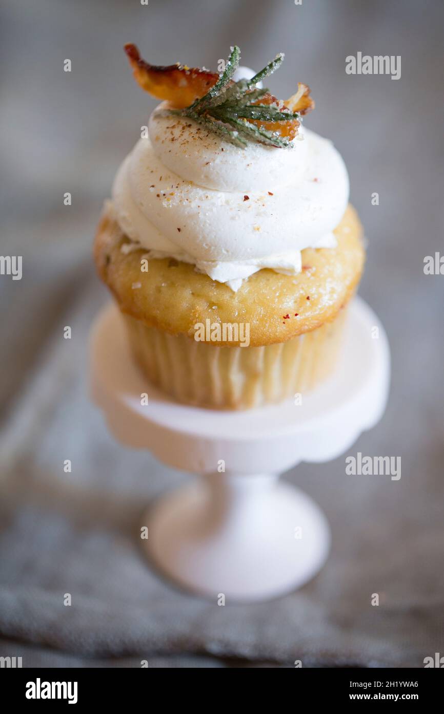 A savoury cupcake with cream cheese, rosemary and bacon Stock Photo - Alamy
