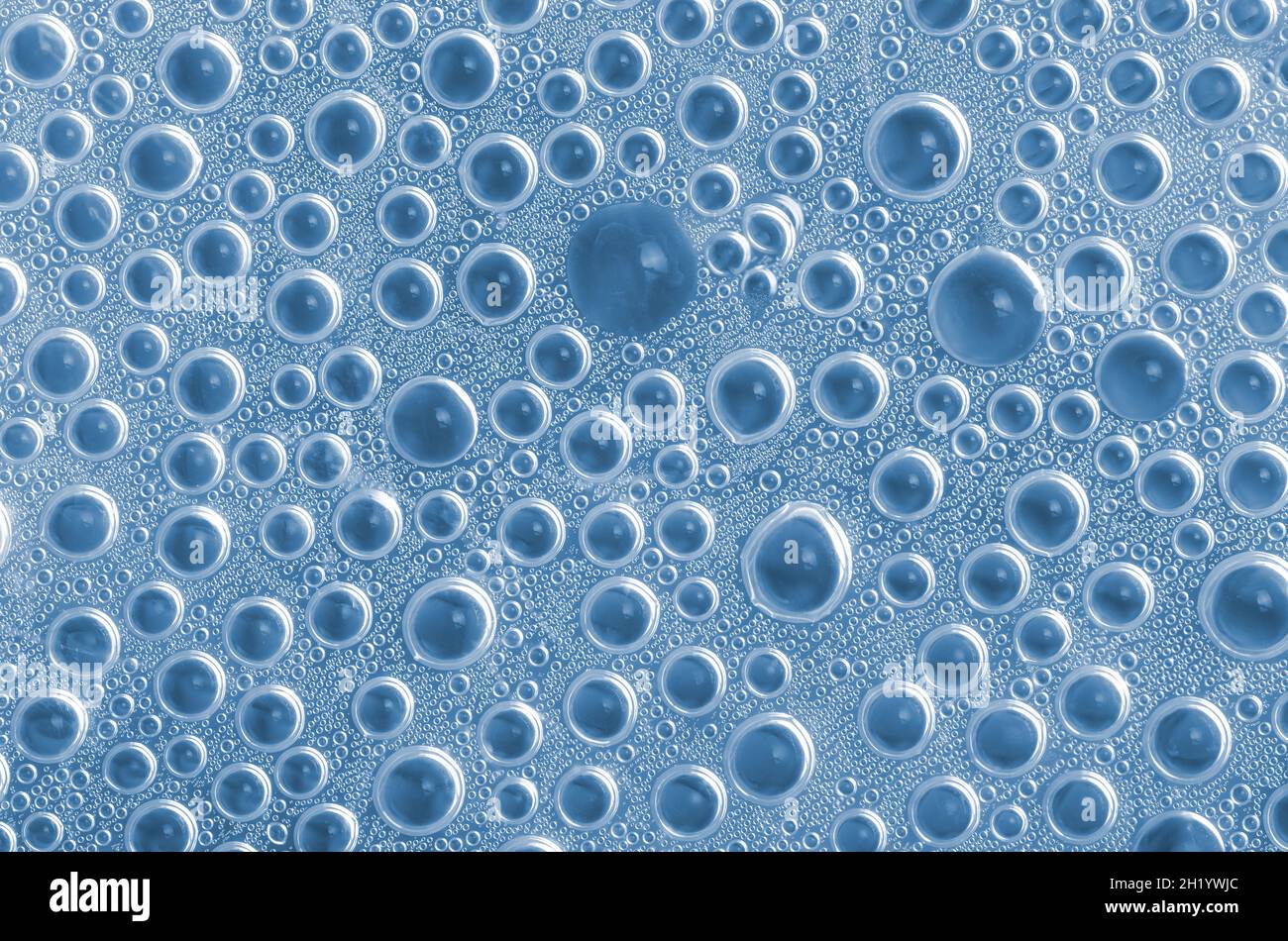 Different size of bubbles come together after steam Stock Photo - Alamy