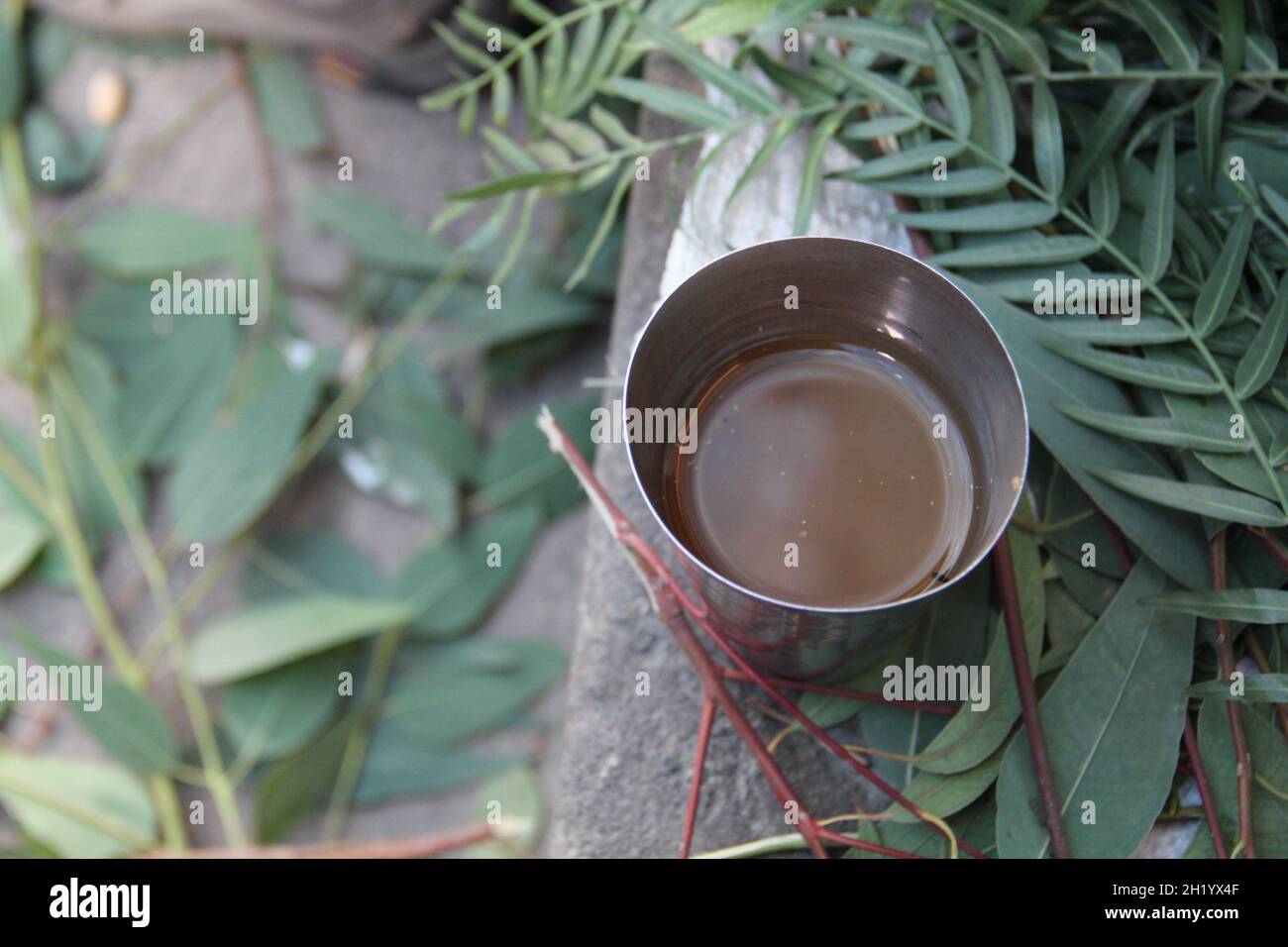 Metal cup of "tella" or "talla", a traditional beer from Ethiopia Stock ...