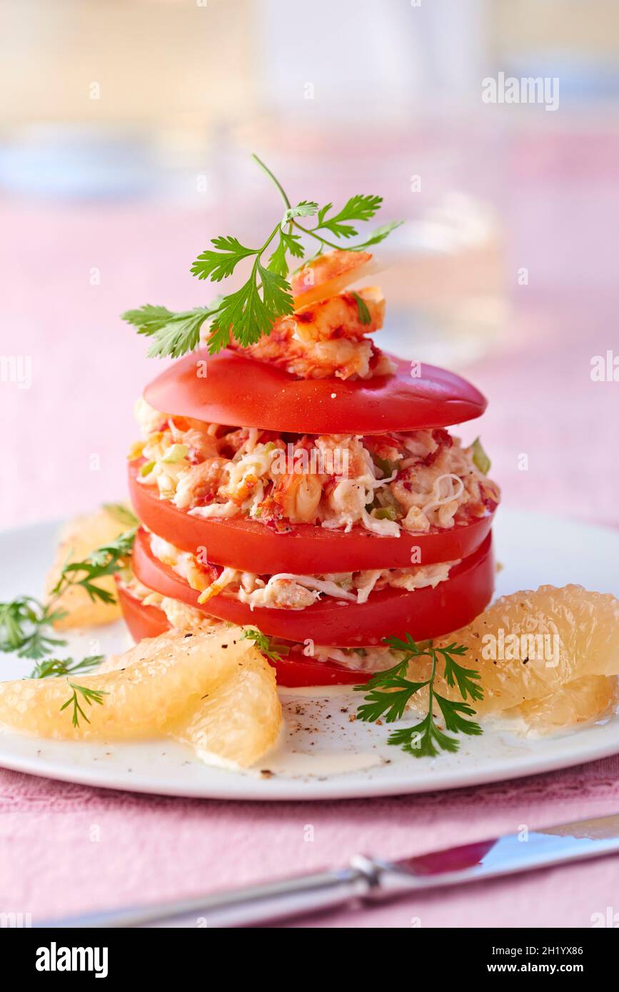 A tomato tower with grapefruit and crab meat Stock Photo - Alamy