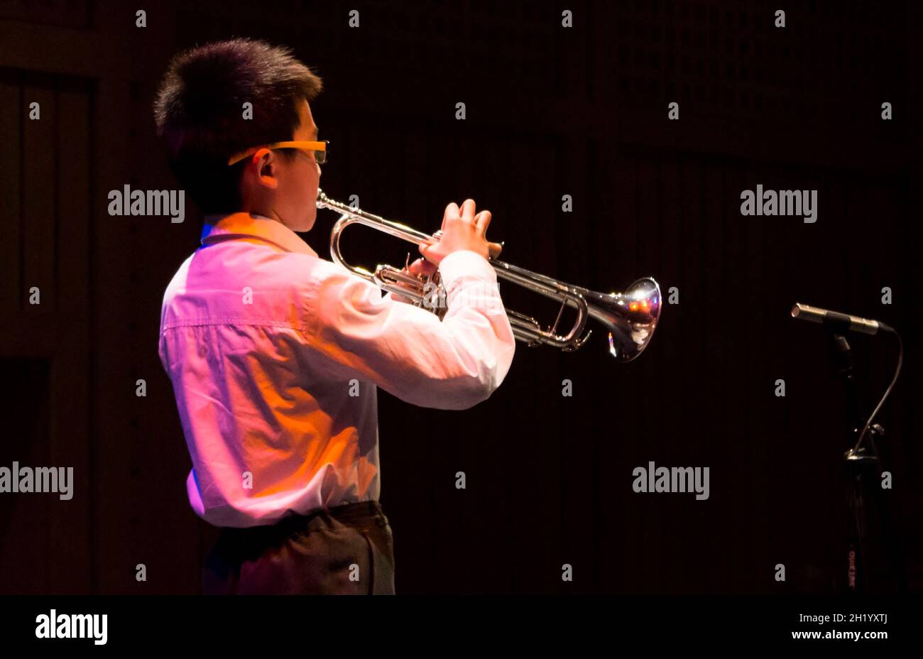Boy playing trumpet Stock Photo - Alamy
