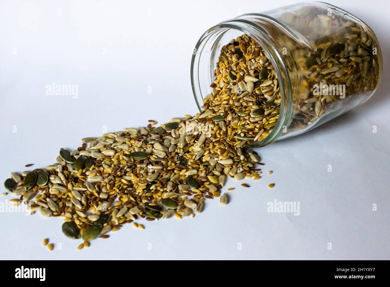 Bottle of healthy seeds Stock Photo - Alamy