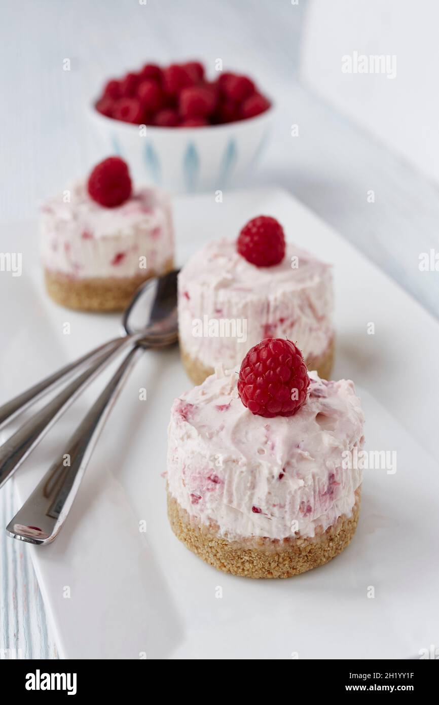 Small Cranachan cheesecakes with raspberries Stock Photo - Alamy