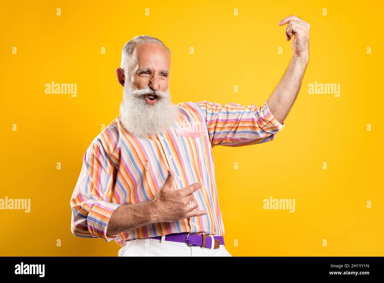 Profile photo of harsh retired man dance make rock gesture wear striped ...