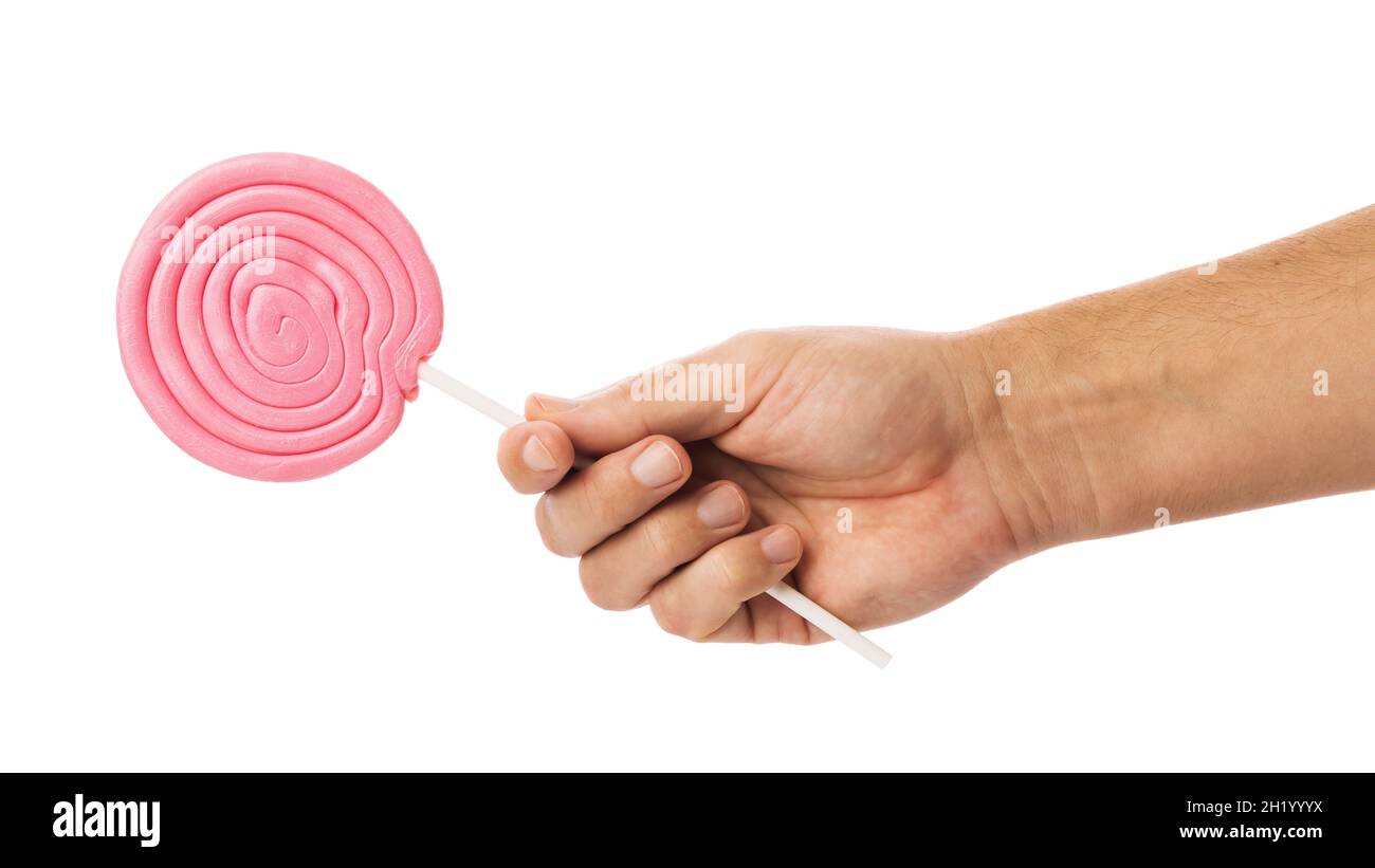Human hand holding lollipop isolated on white background, template for ...
