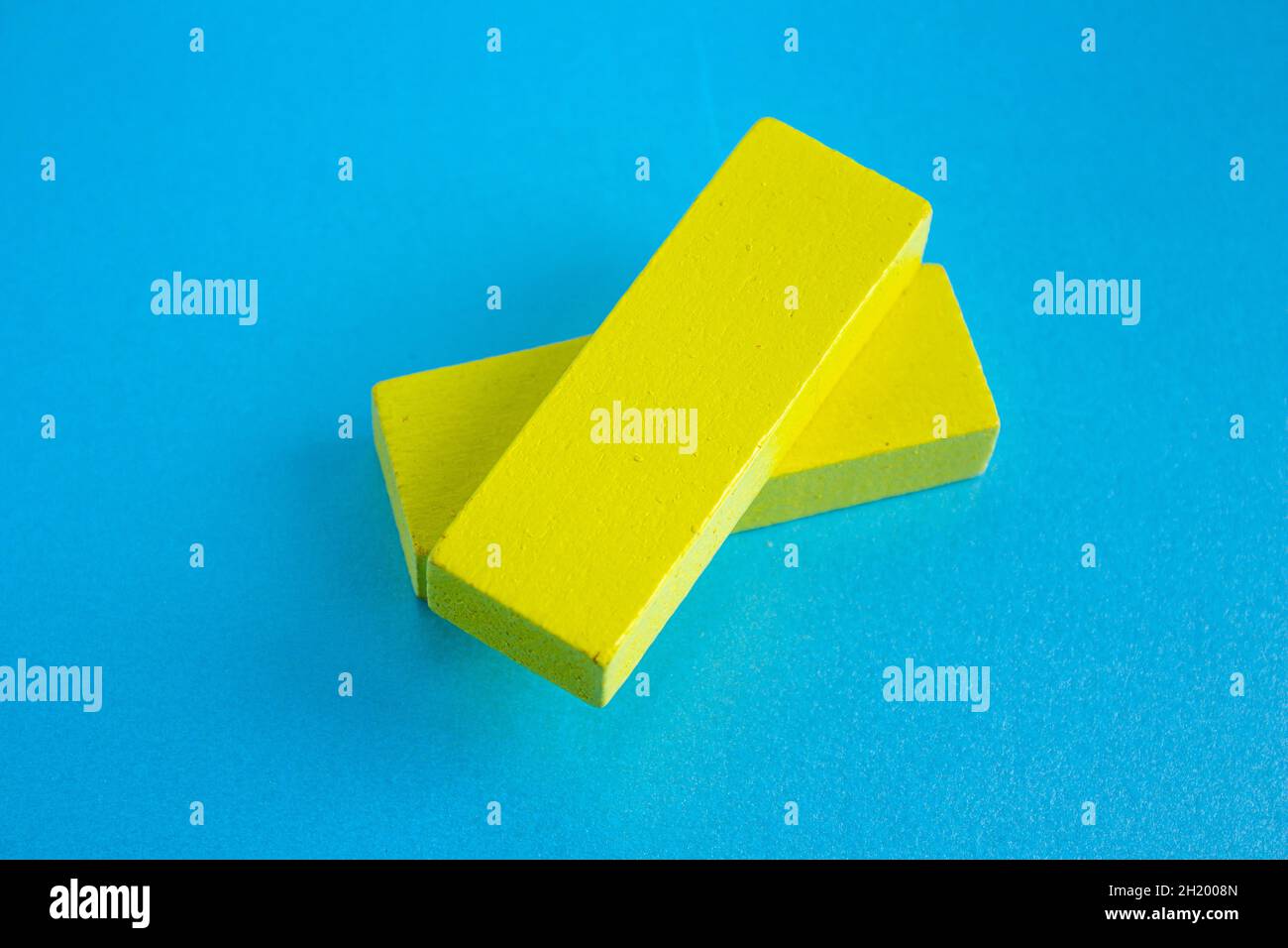 Yellow wooden blocks, top view of yellow wooden blocks isolated on blue ...