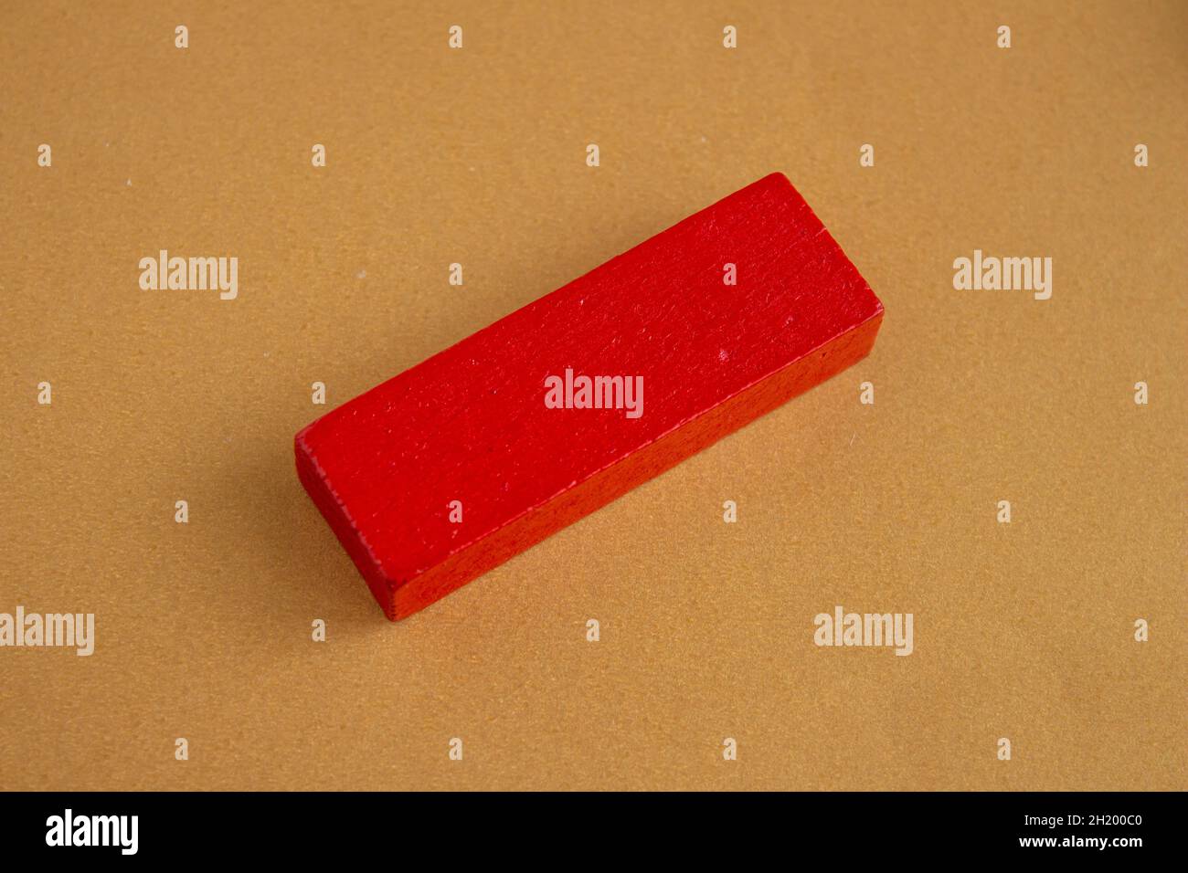 Red wooden block, top view of red wooden block isolated on caramel ...