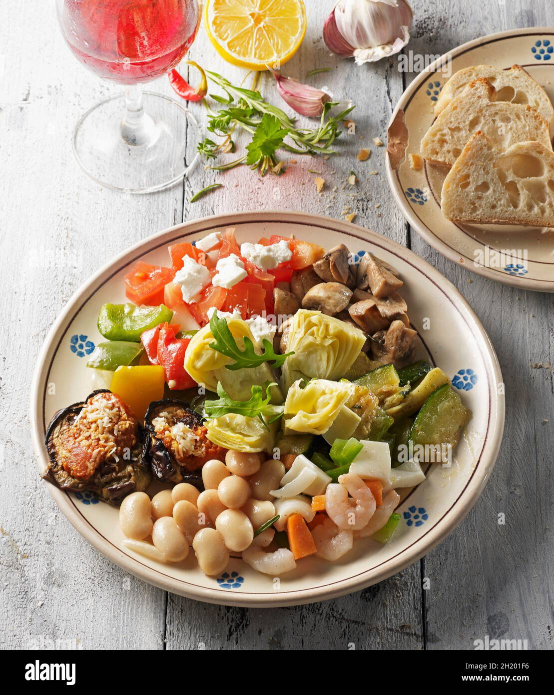 Italian appetiser platter served with bread and red wine Stock Photo ...