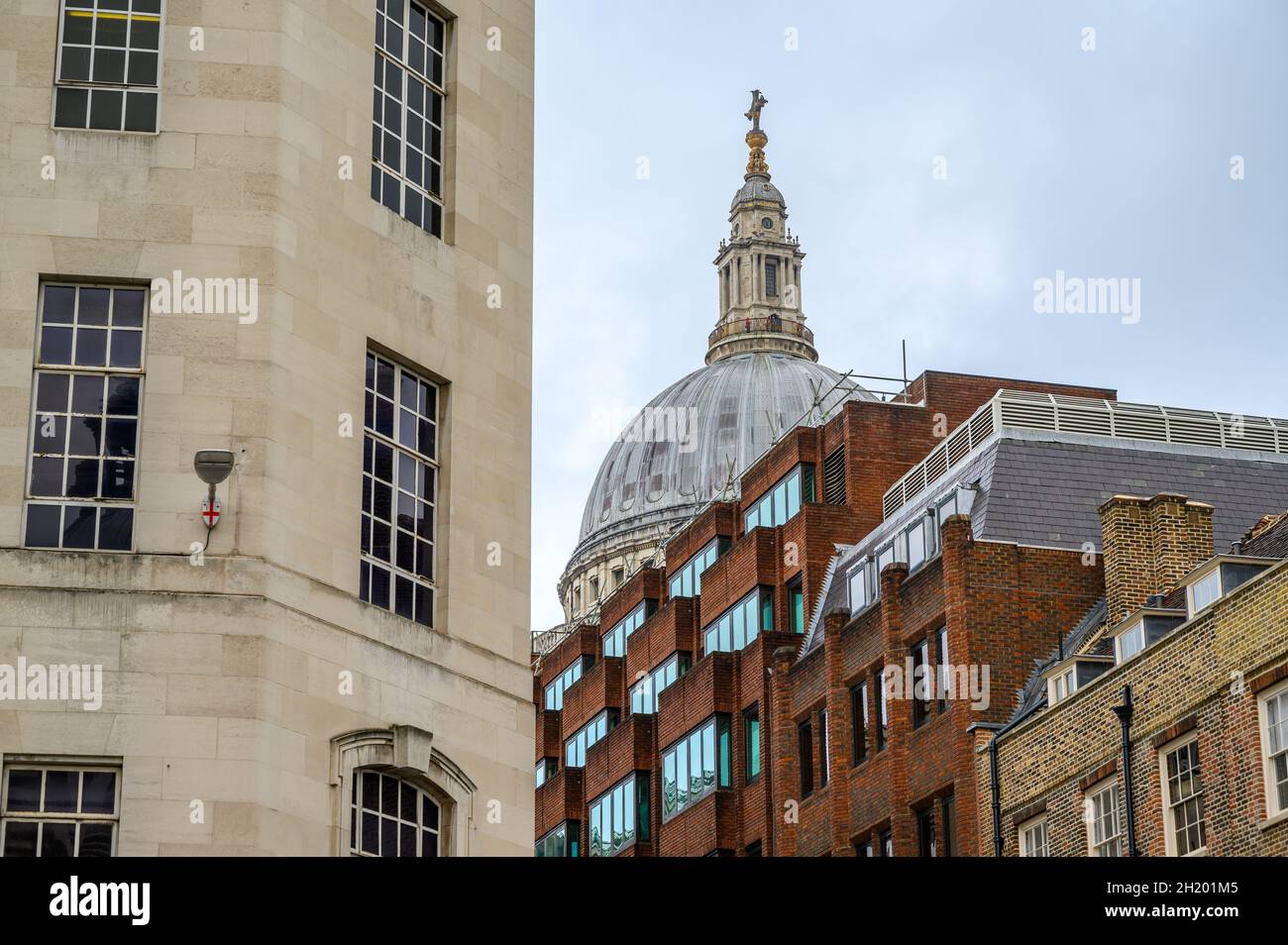 The dome of St Paul's Cathedral visible behind buildings in Godliman ...