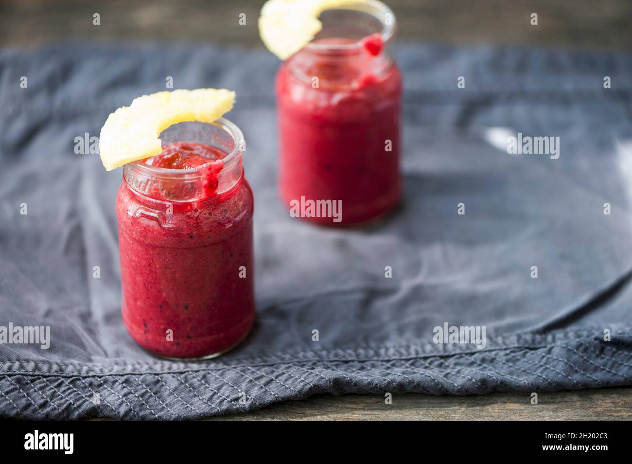 Raspberry, strawberry and pineapple smoothies Stock Photo - Alamy