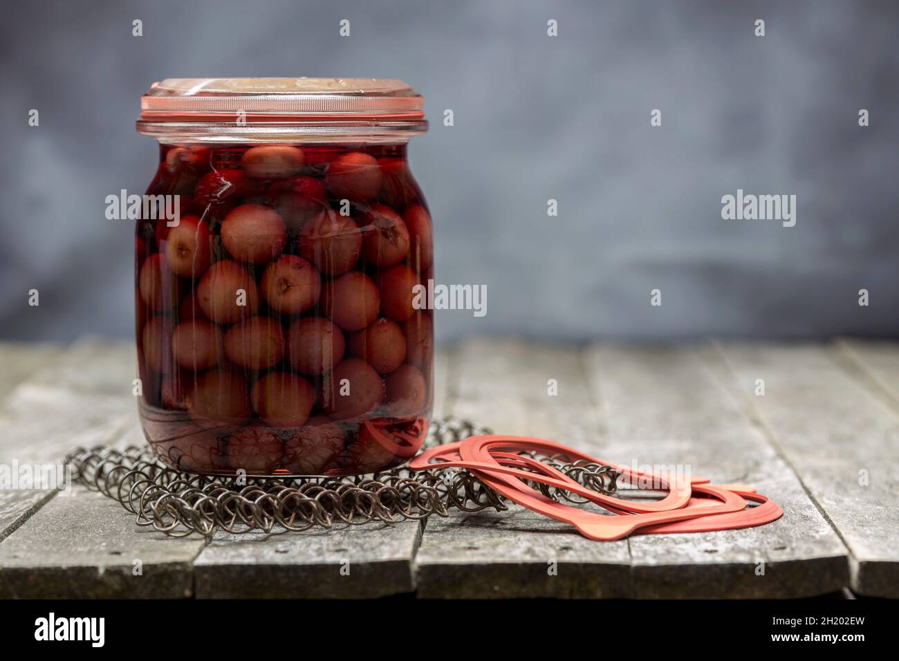 Preserved cherries in a glass jar Stock Photo - Alamy