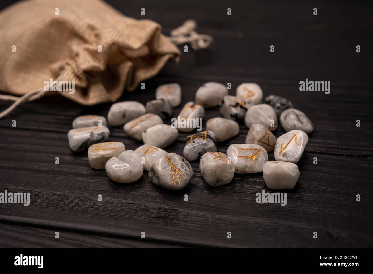 Runes stones with symbols. Stack of runes on gray background Stock ...