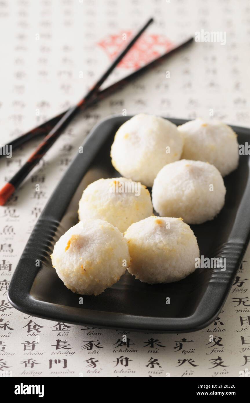 Stuffed coconut balls Stock Photo - Alamy