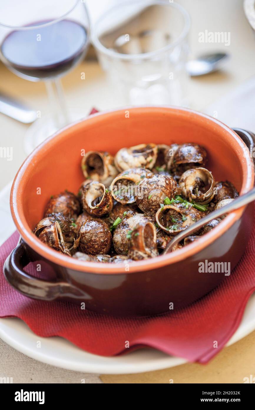 Snails with herb butter Stock Photo - Alamy