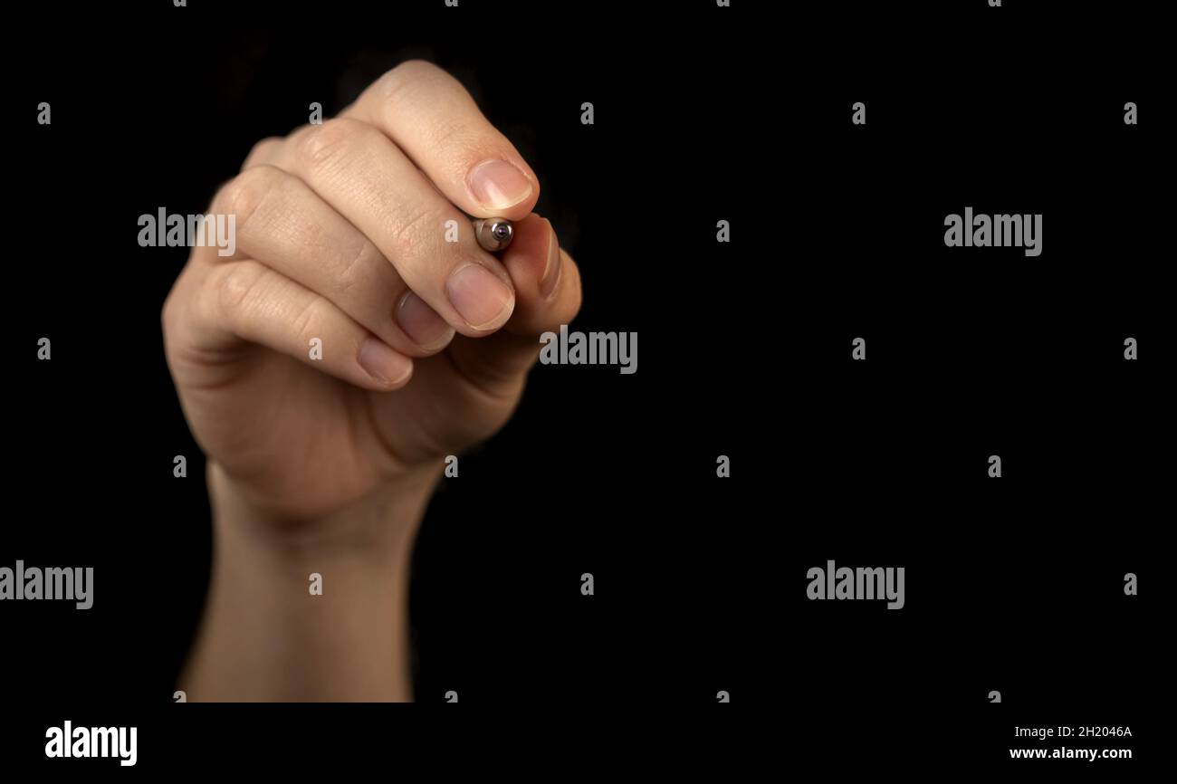 Writing on a touch screen concept photo. Black background with copy ...