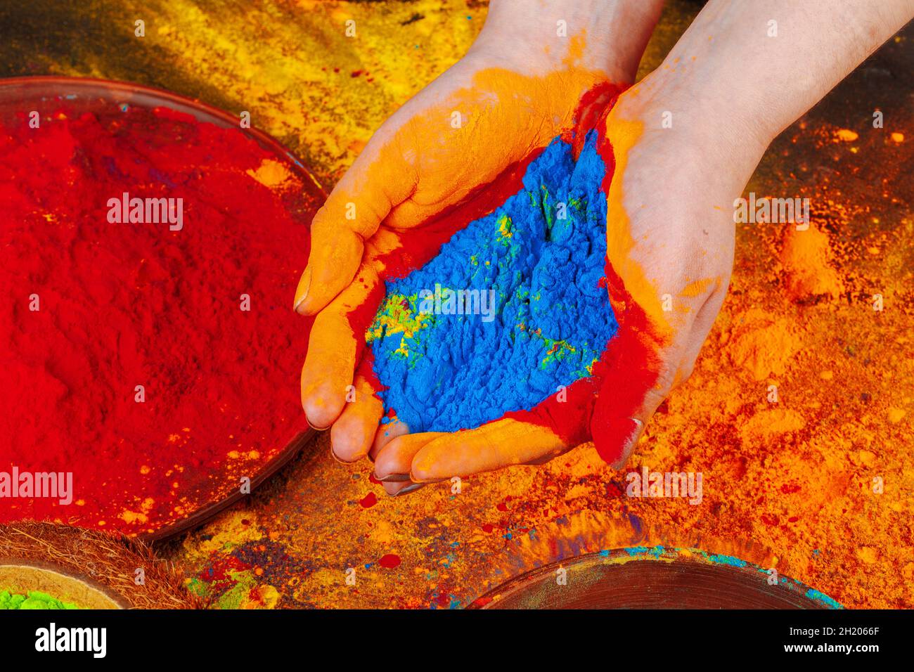 Hands holding Holi powder paint, view from above Stock Photo - Alamy