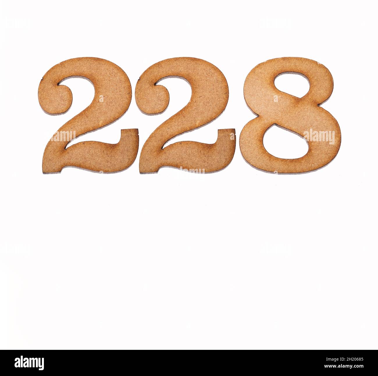Number 228 in wood, isolated on white background Stock Photo - Alamy