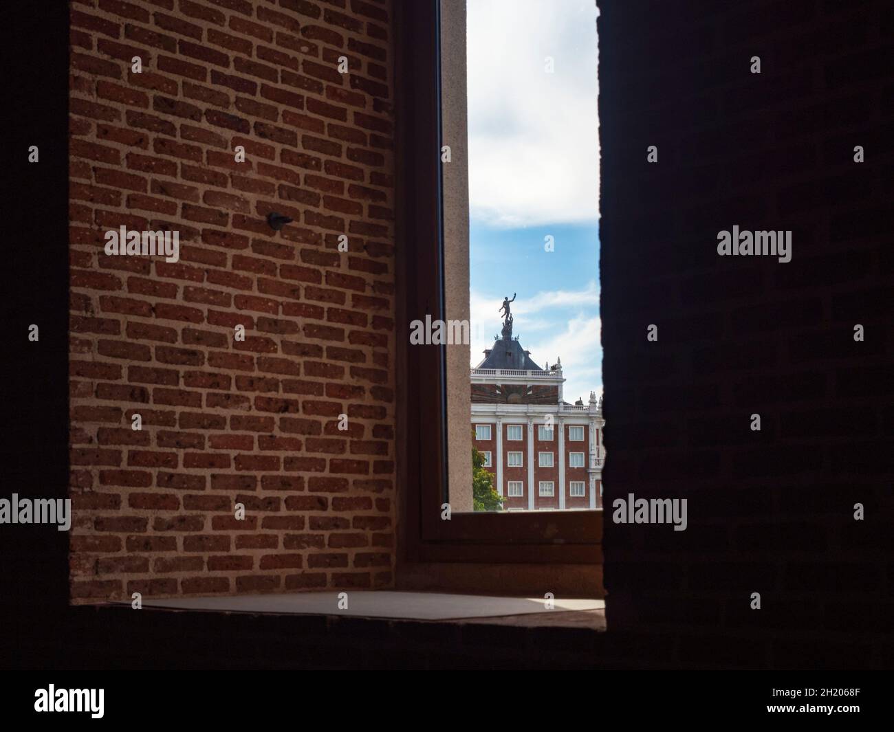 Brick window overlooking the historic center of Madrid Stock Photo - Alamy
