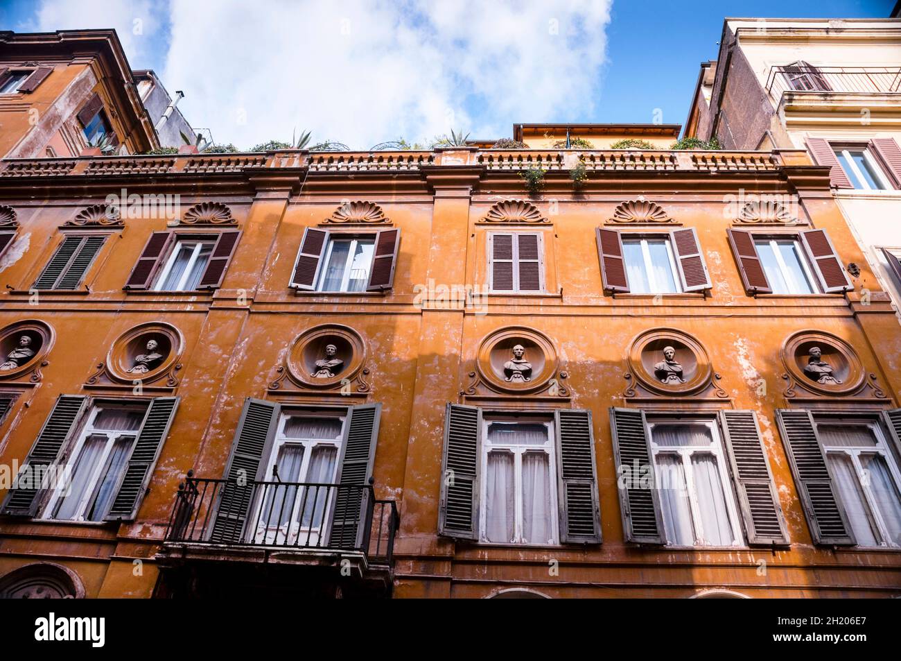 Rooftop terrace, embellished niches and shell motif window pediments in ...