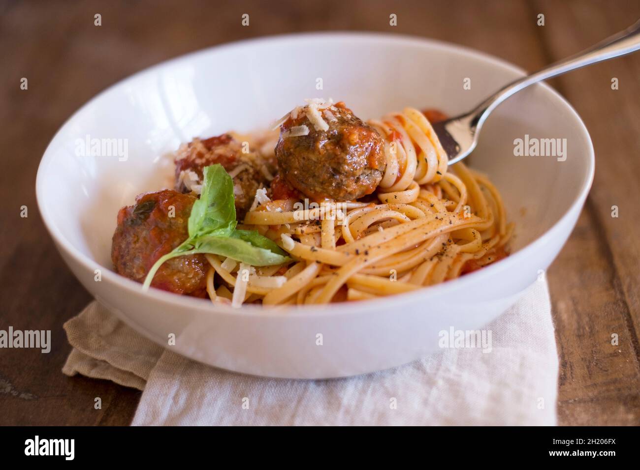 Tagliatelle with meatballs in tomato sauce Stock Photo - Alamy
