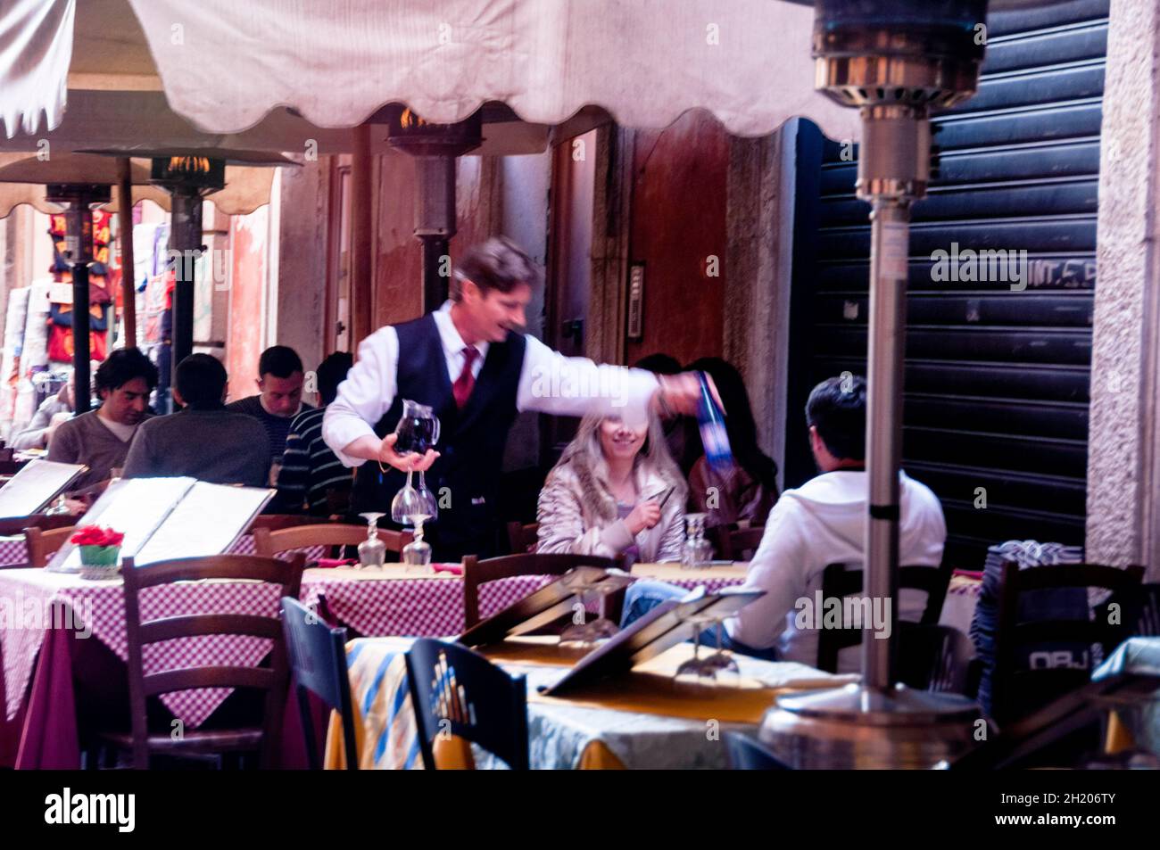 Rome restaurant with red wine, outdoor ambiance and red checkered ...