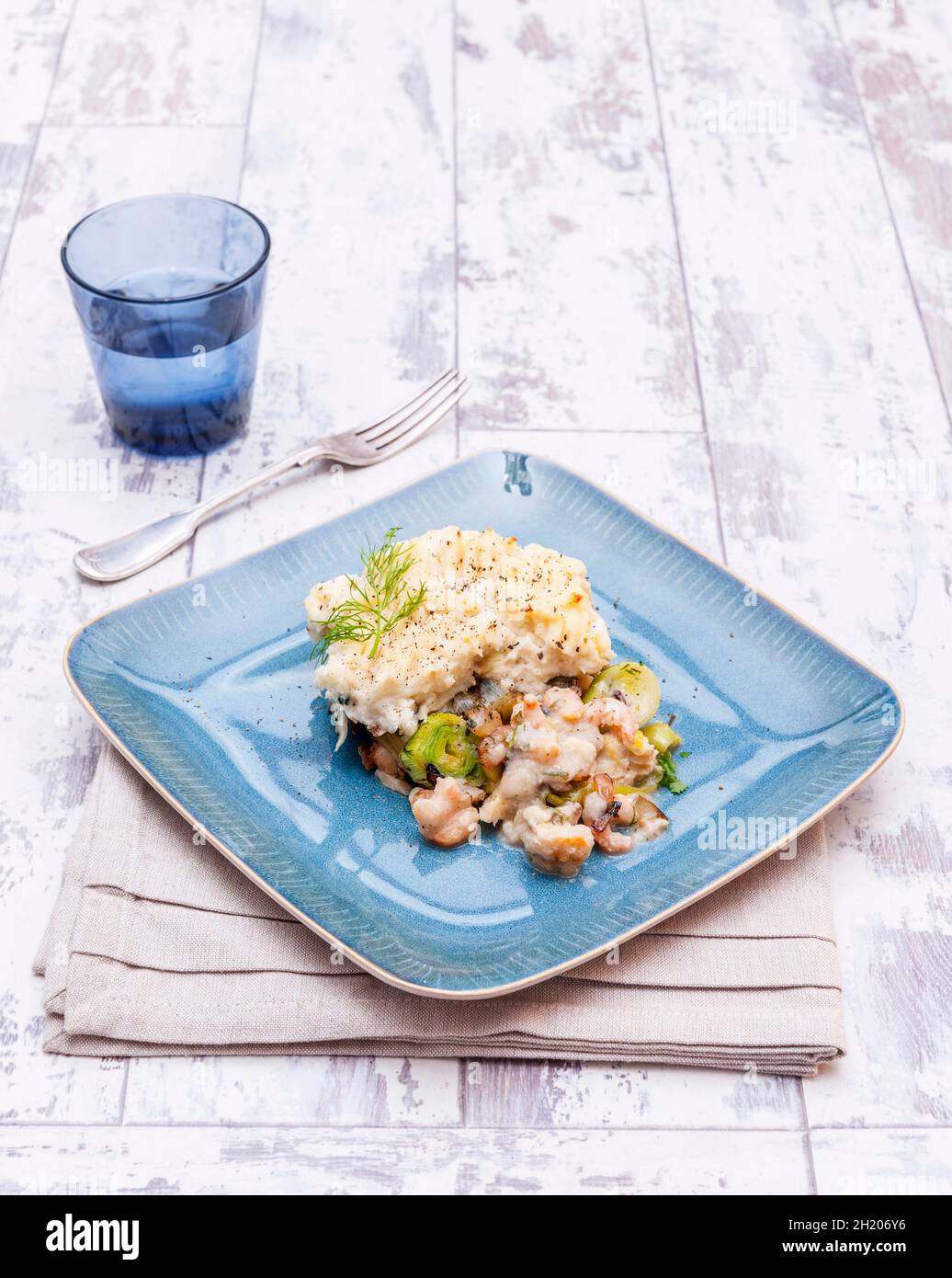 A portion of fish pie with prawns Stock Photo - Alamy