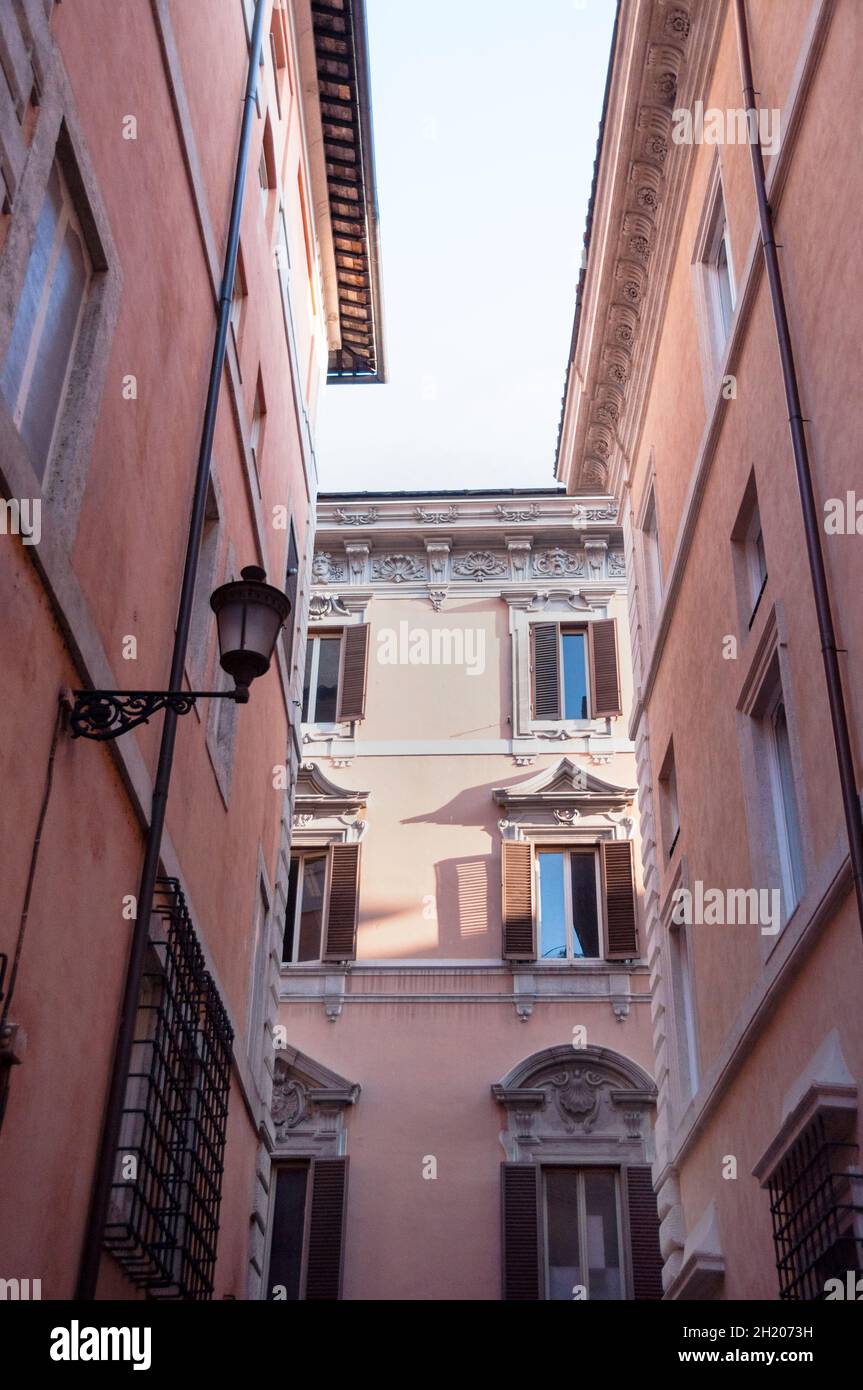 Arched and pointed window pediments in Rome, Italy Stock Photo - Alamy