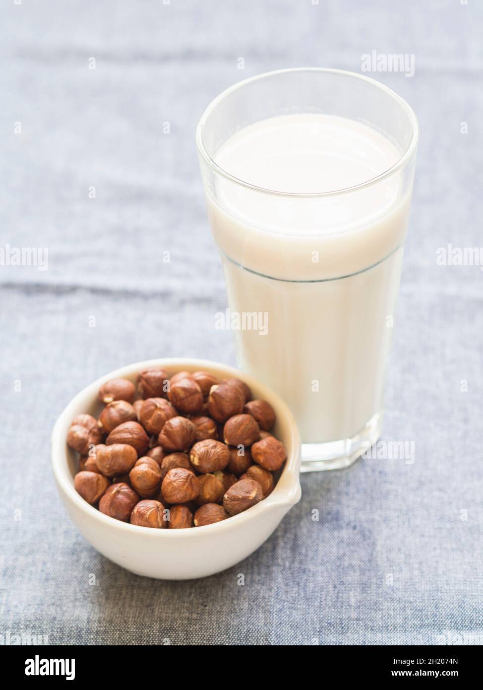 Homemade organic hazelnut milk in a tall glass Stock Photo - Alamy