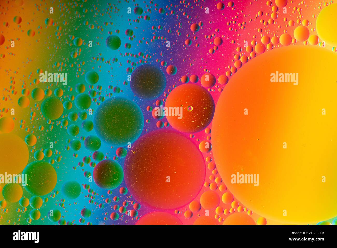 Macro photography of the oil drops on the water surface.Cosmic circles ...